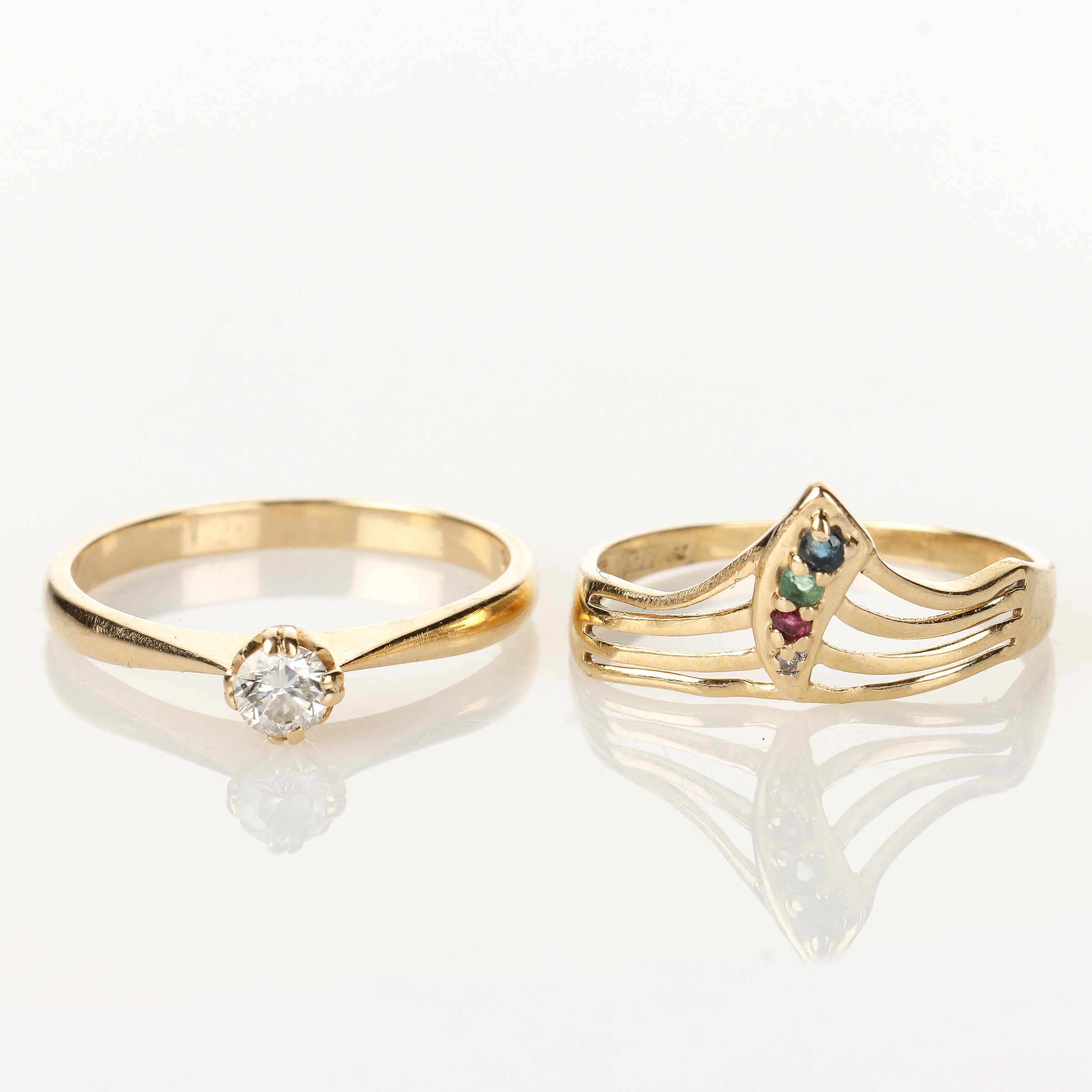 Brilliant solitaire ring, approx. 0.20 ct and ring with colored stones, 18 kt gold | Lauritz.com